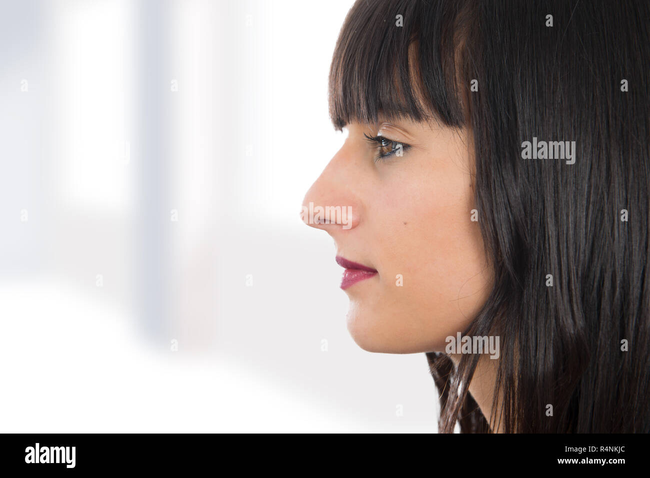 portrait of beautiful brunette girl, side view Stock Photo - Alamy