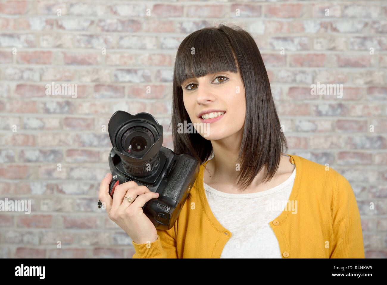 Attractive brunette woman with photo camera Stock Photo - Alamy