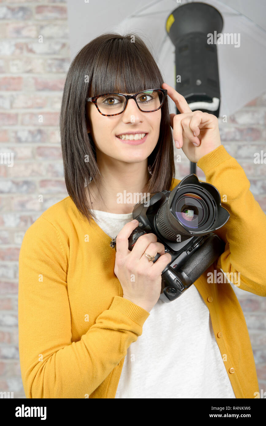 Attractive brunette woman with photo camera Stock Photo - Alamy