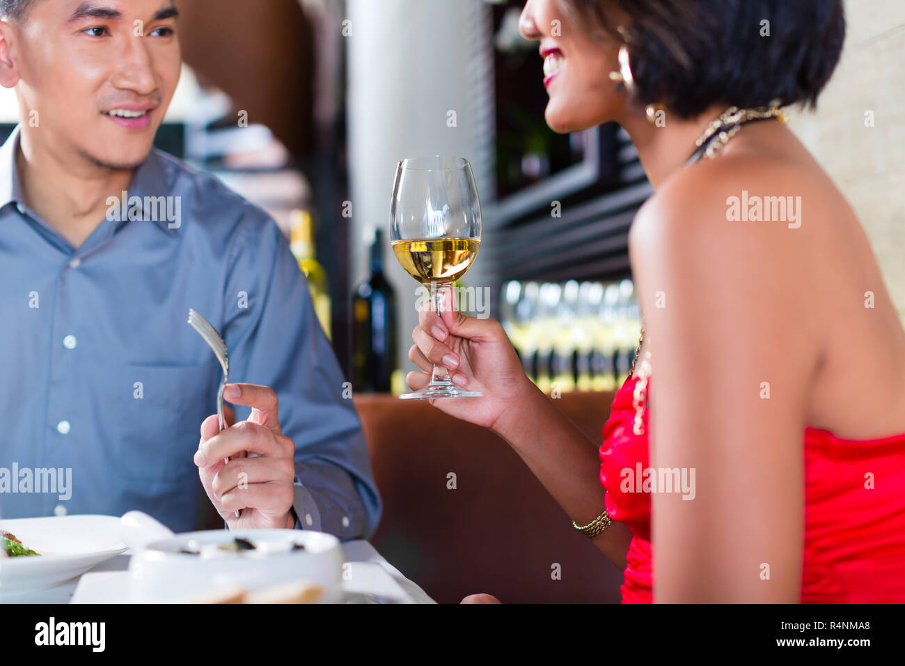 Asian couple fine dining in restaurant Stock Photo - Alamy