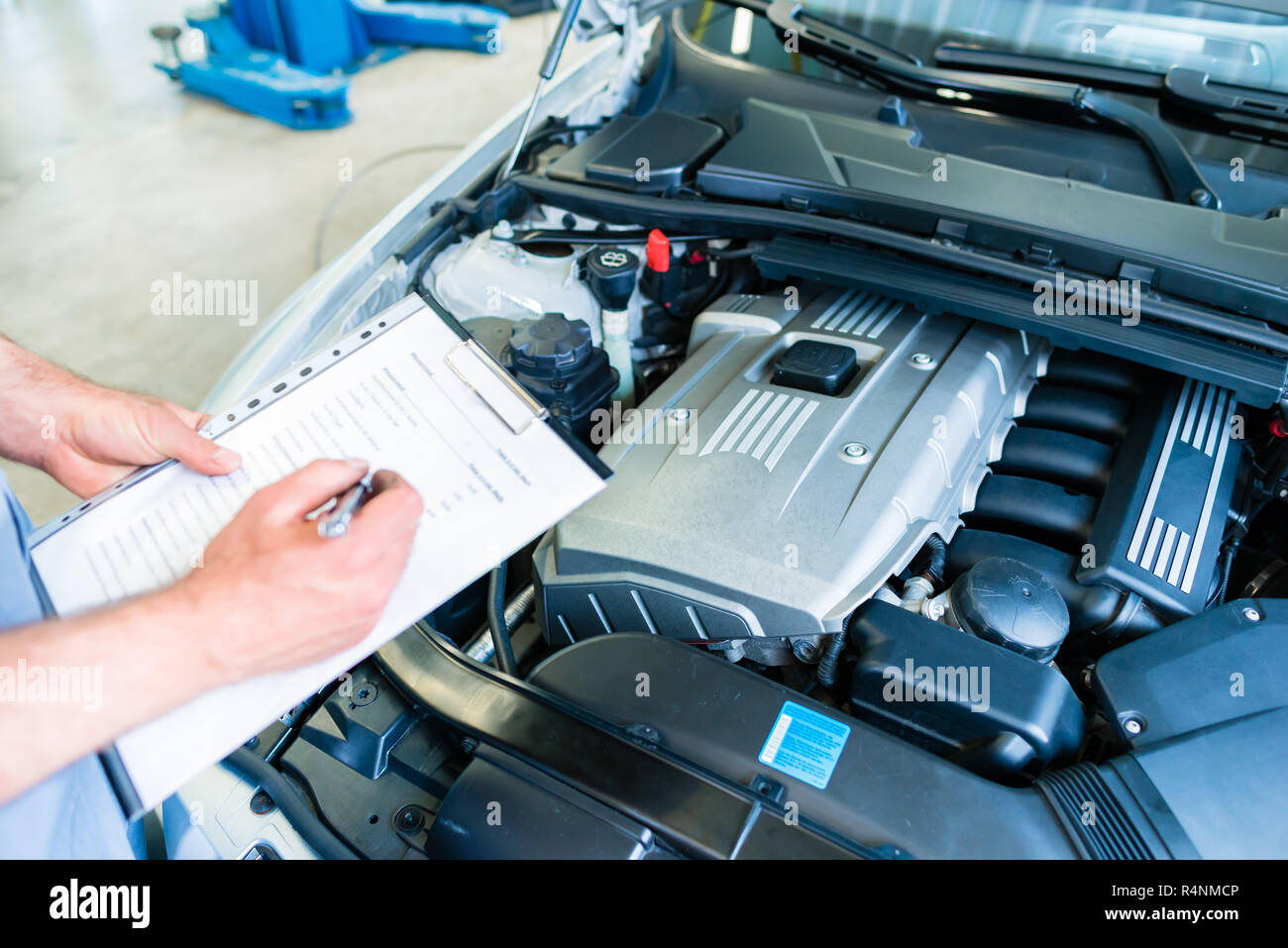 Engineer checking locomotive in train hi-res stock photography and ...