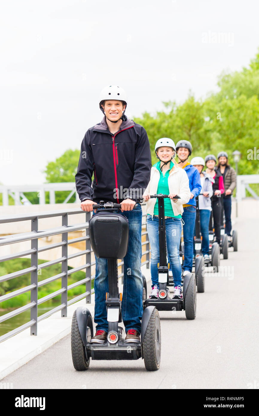 Tourist group driving Segway at sightseeing tour Stock Photo - Alamy