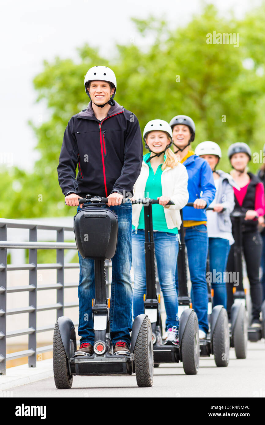 Tourist group driving Segway at sightseeing tour Stock Photo - Alamy