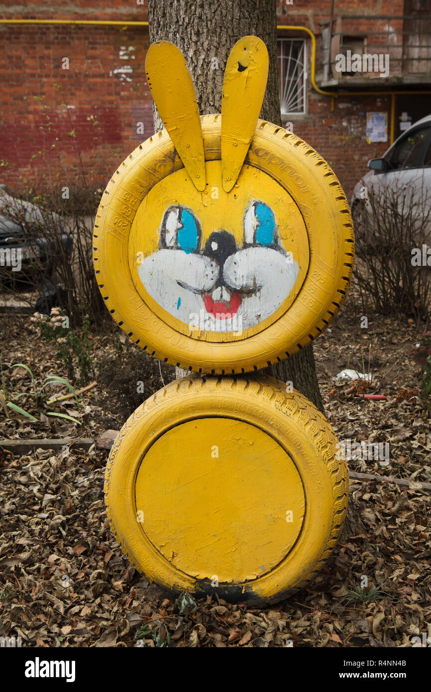 Yellow hare made from waste tyres on the child's playground in Ivanovo ...