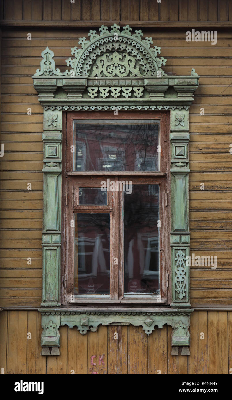 Traditional Russian carved window frame (nalichnik) on the wooden house ...