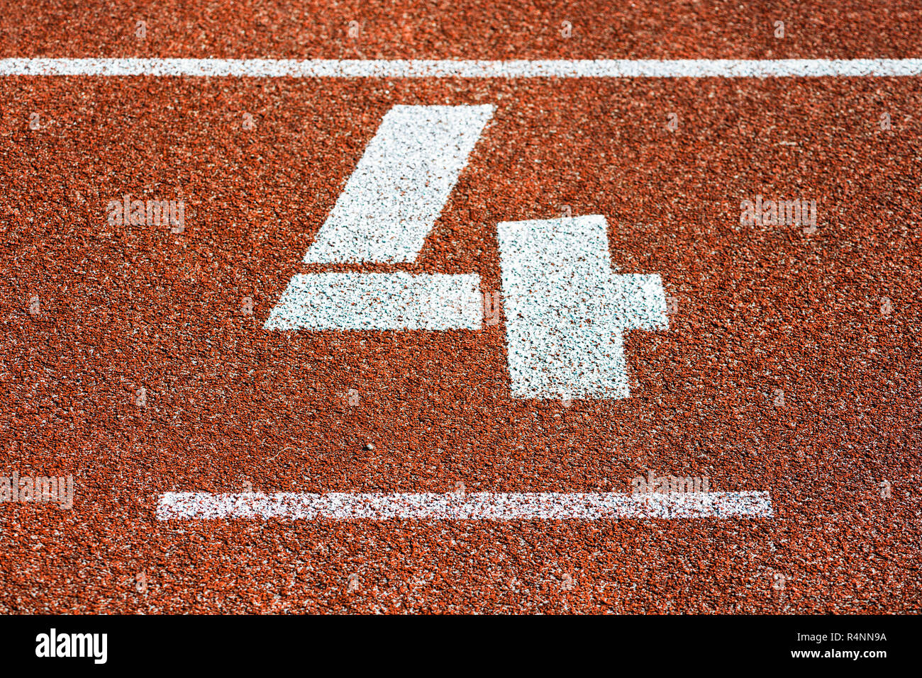 Start number four at cinder track of track and field running track ...