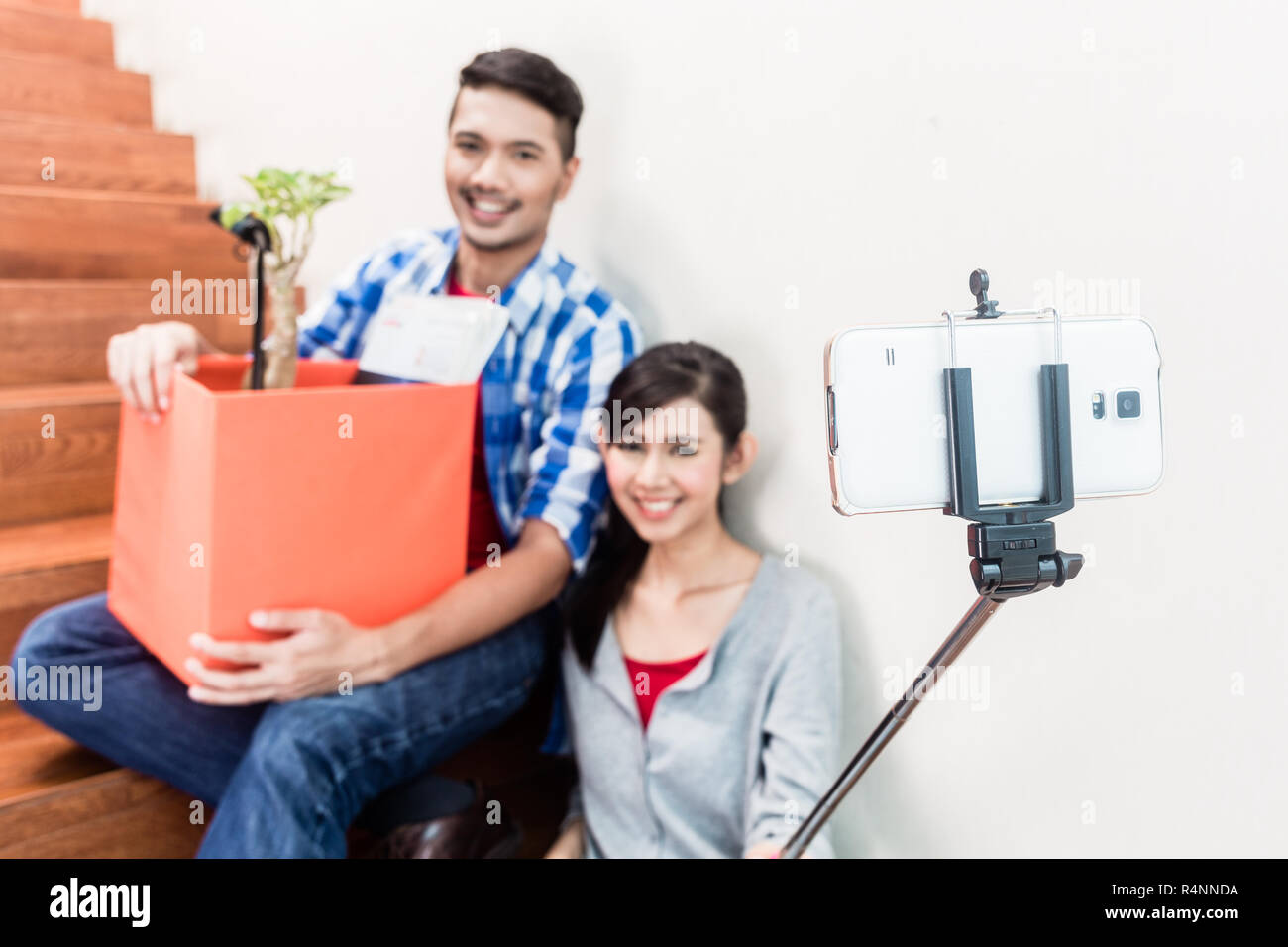Asian couple taking selfie from their moving day Stock Photo - Alamy
