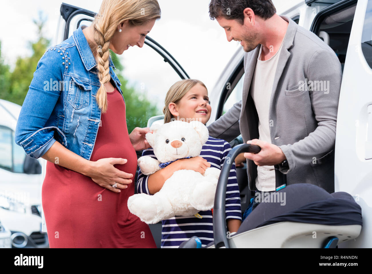 Family buying car, mother, father and child at dealership Stock Photo ...
