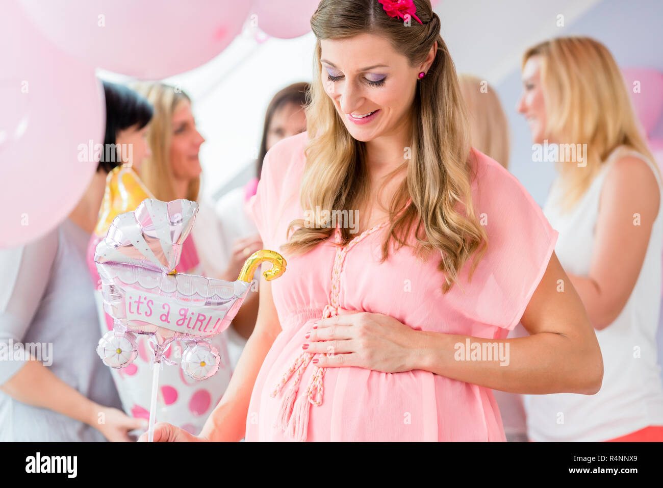 Pregnant girl celebrating baby shower party with friends Stock Photo ...