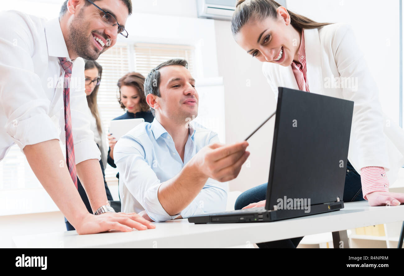 Business team reporting to boss having meeting in office Stock Photo ...