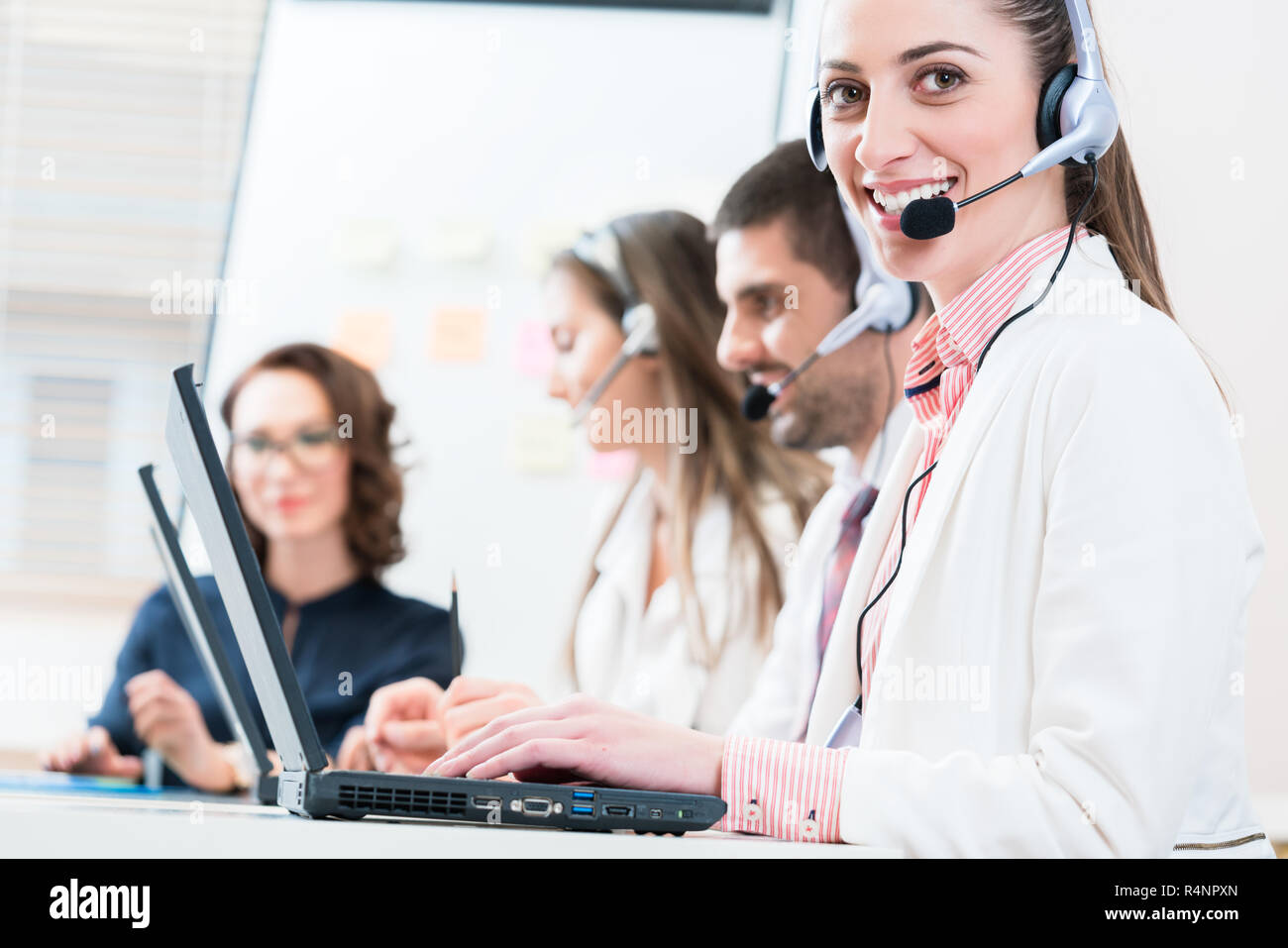 Call centre agents talking business hi-res stock photography and images ...