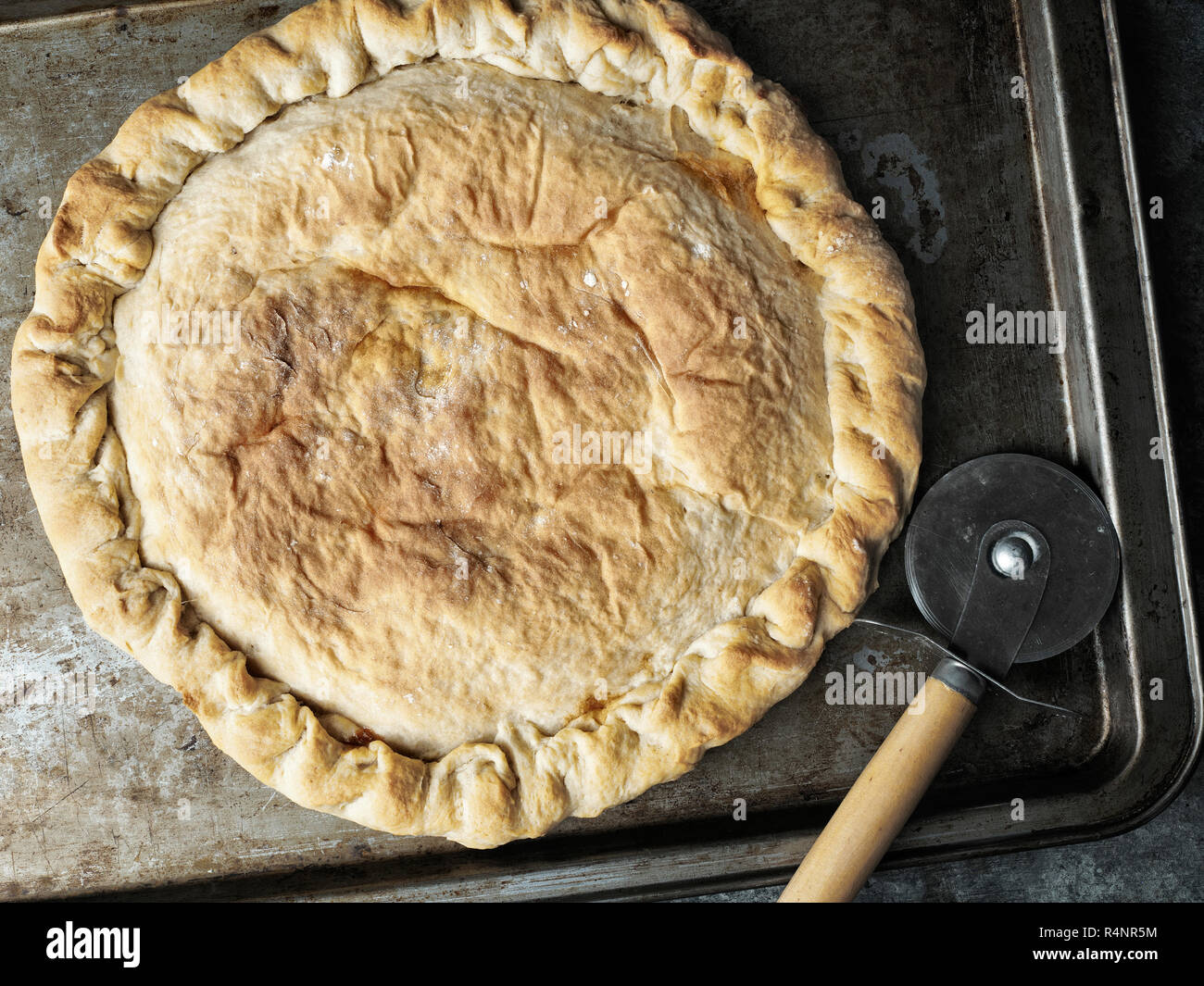 rustic italian calzone stuffed pizza Stock Photo - Alamy