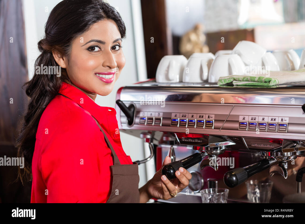 Barista woman making coffee in cafe with machine Stock Photo - Alamy