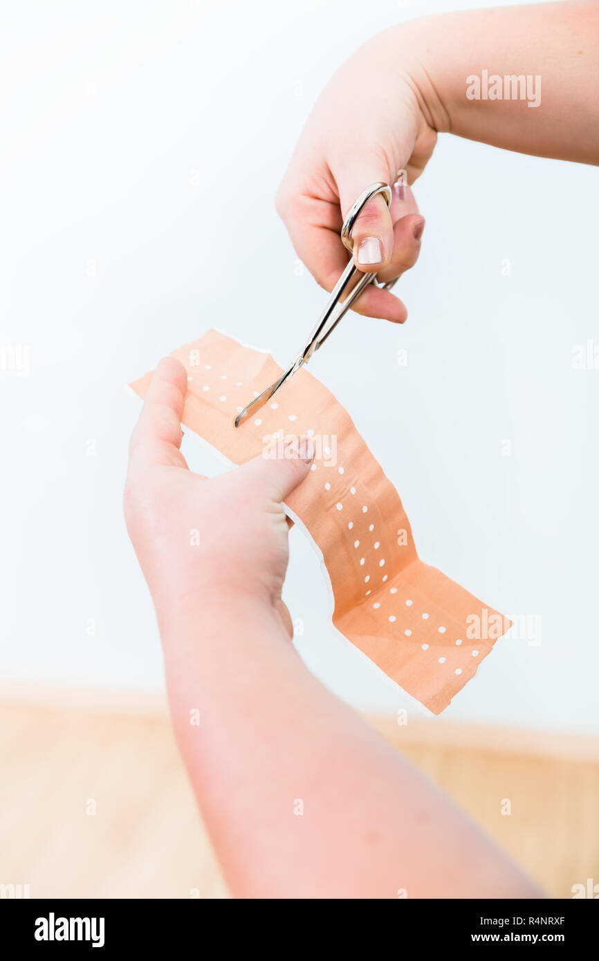 In First aid class, Cutting of patch for smaller lesions Stock Photo ...