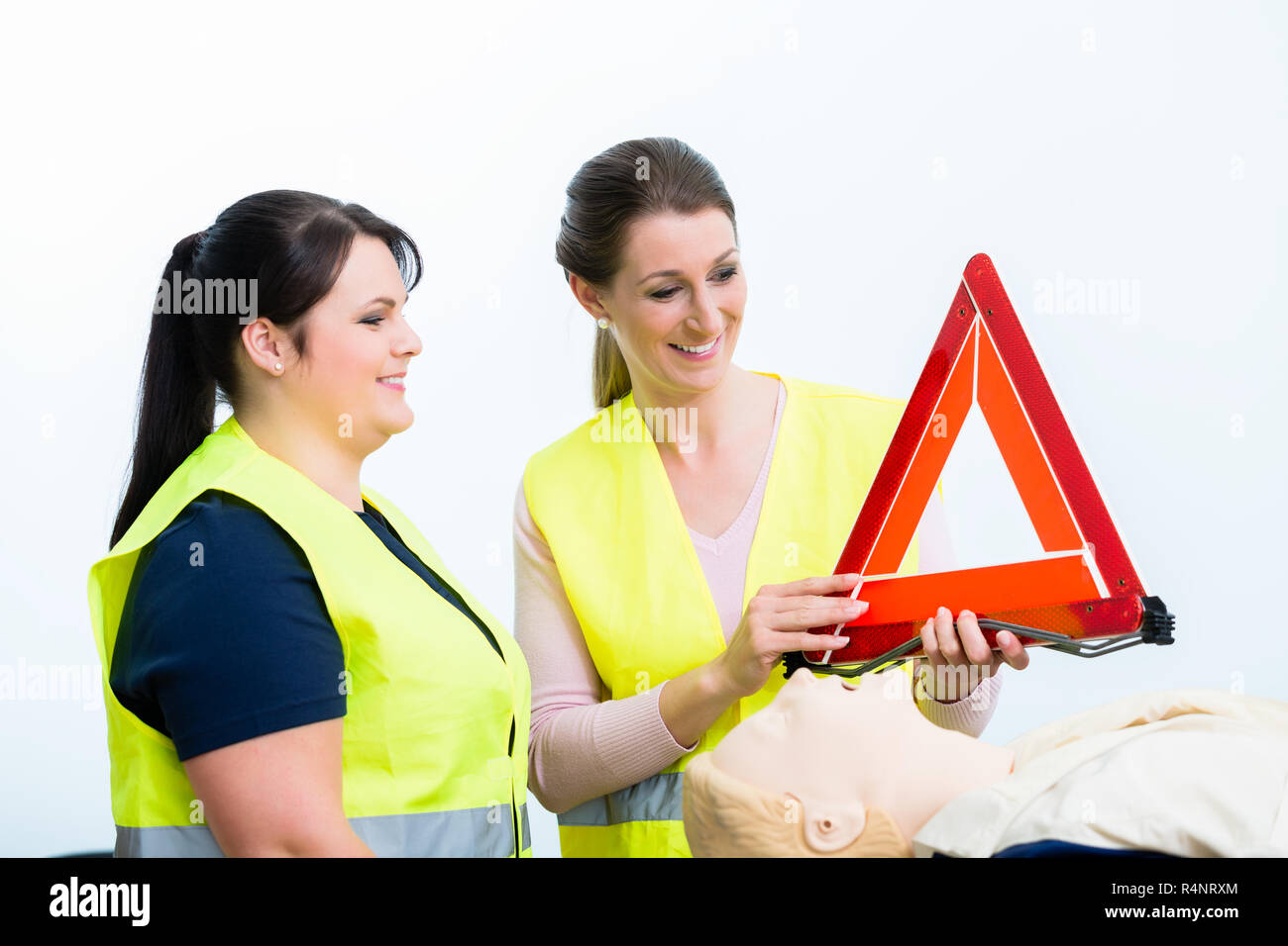 Women in first aid course learning to secure road crash site Stock ...