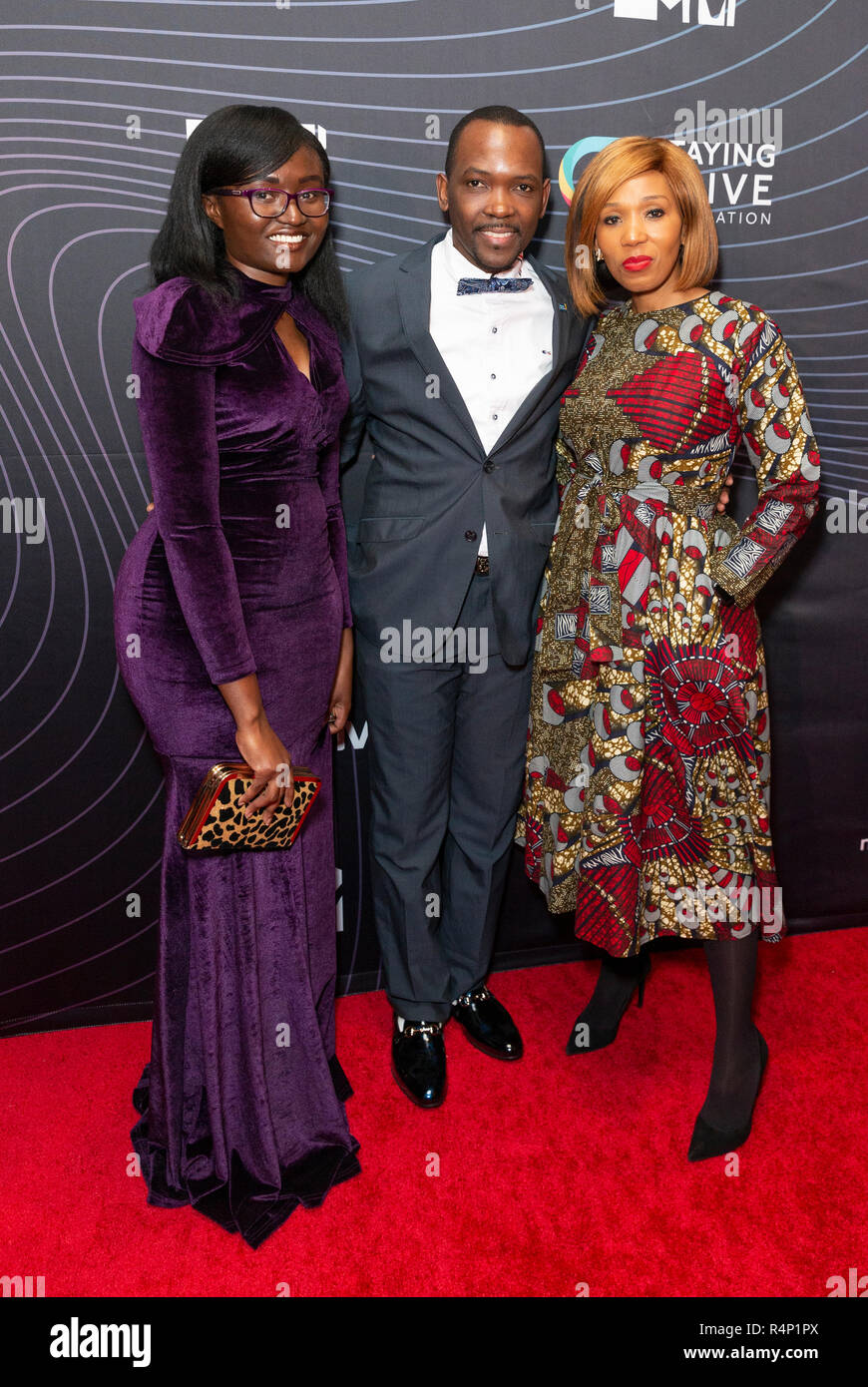 New York, NY - November 27, 2018: Shirley Sabrina Oruko, Henry Luyombya ...