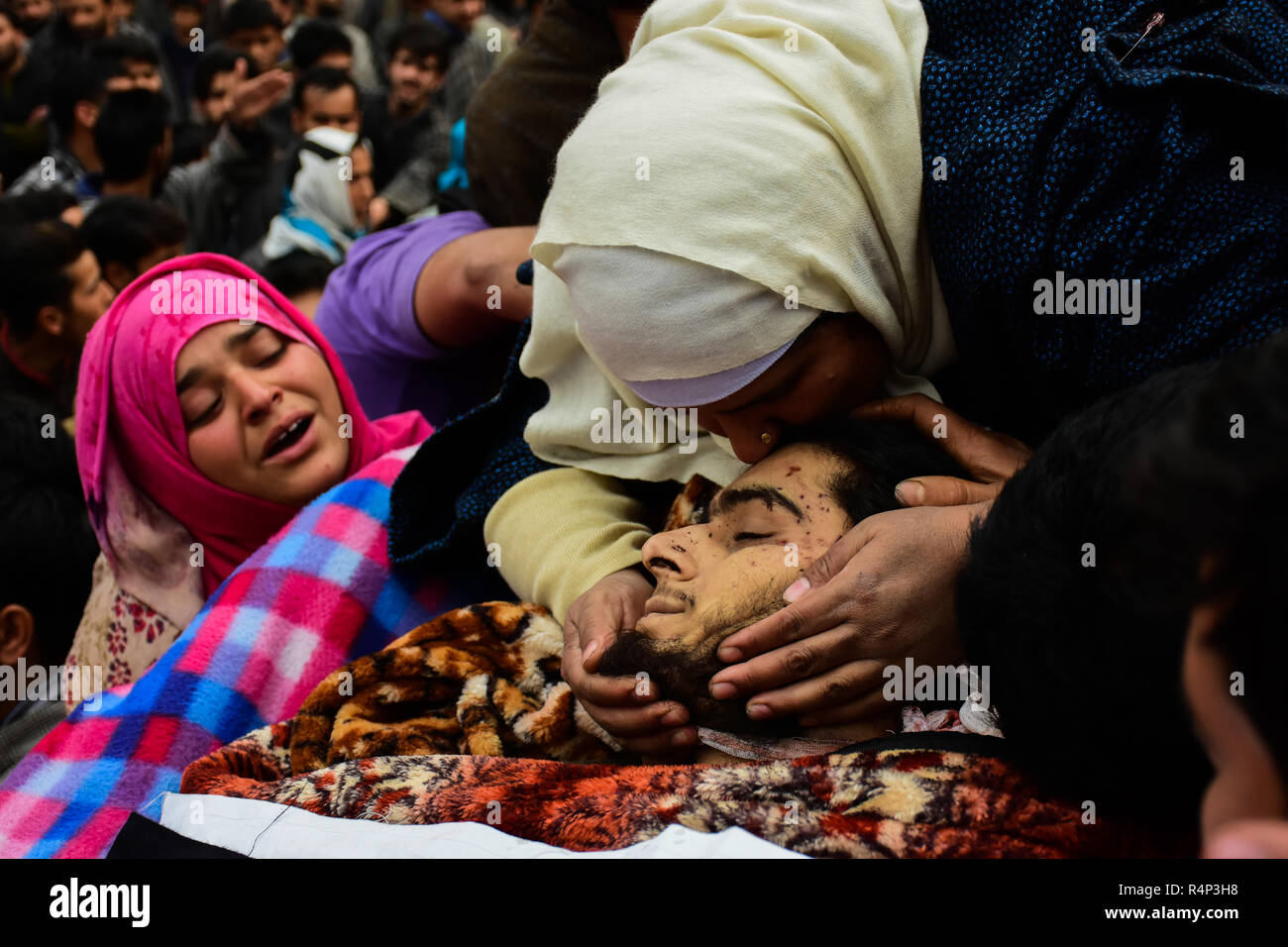 A large number of people attend the funeral of alleged militant Shakir ...