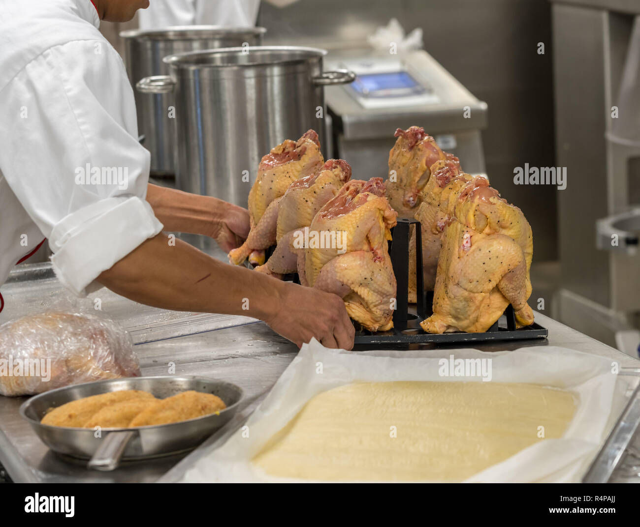 Modern stainless steel hobs in commercial kitchen Stock Photo - Alamy