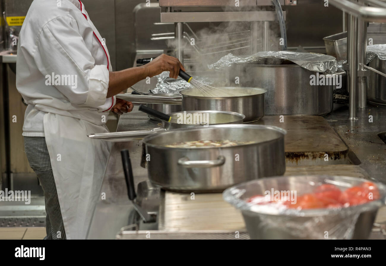 Modern stainless steel hobs in commercial kitchen Stock Photo - Alamy