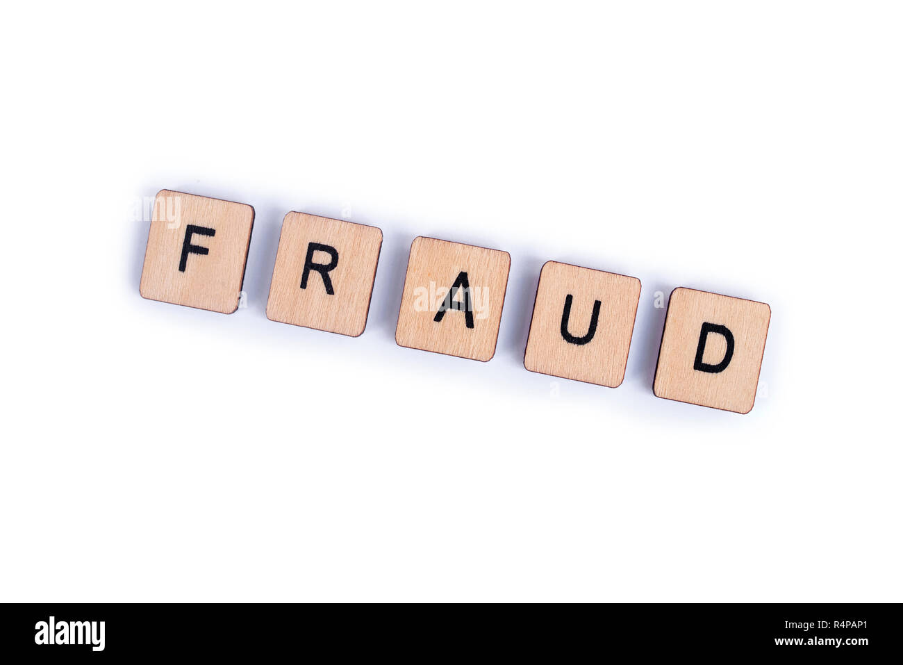 The word FRAUD, spelt with wooden tile letters Stock Photo - Alamy