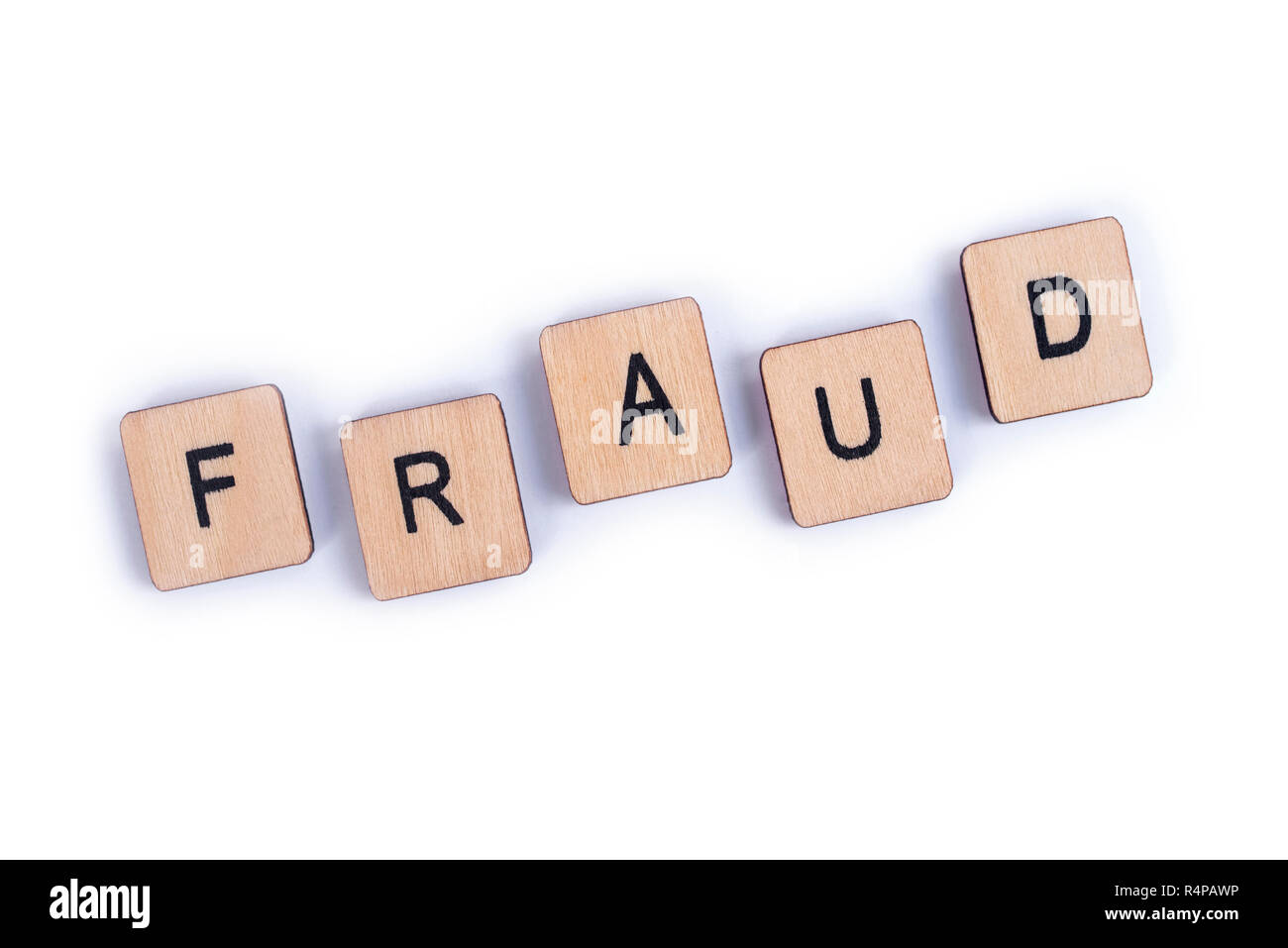 The word FRAUD, spelt with wooden tile letters Stock Photo - Alamy