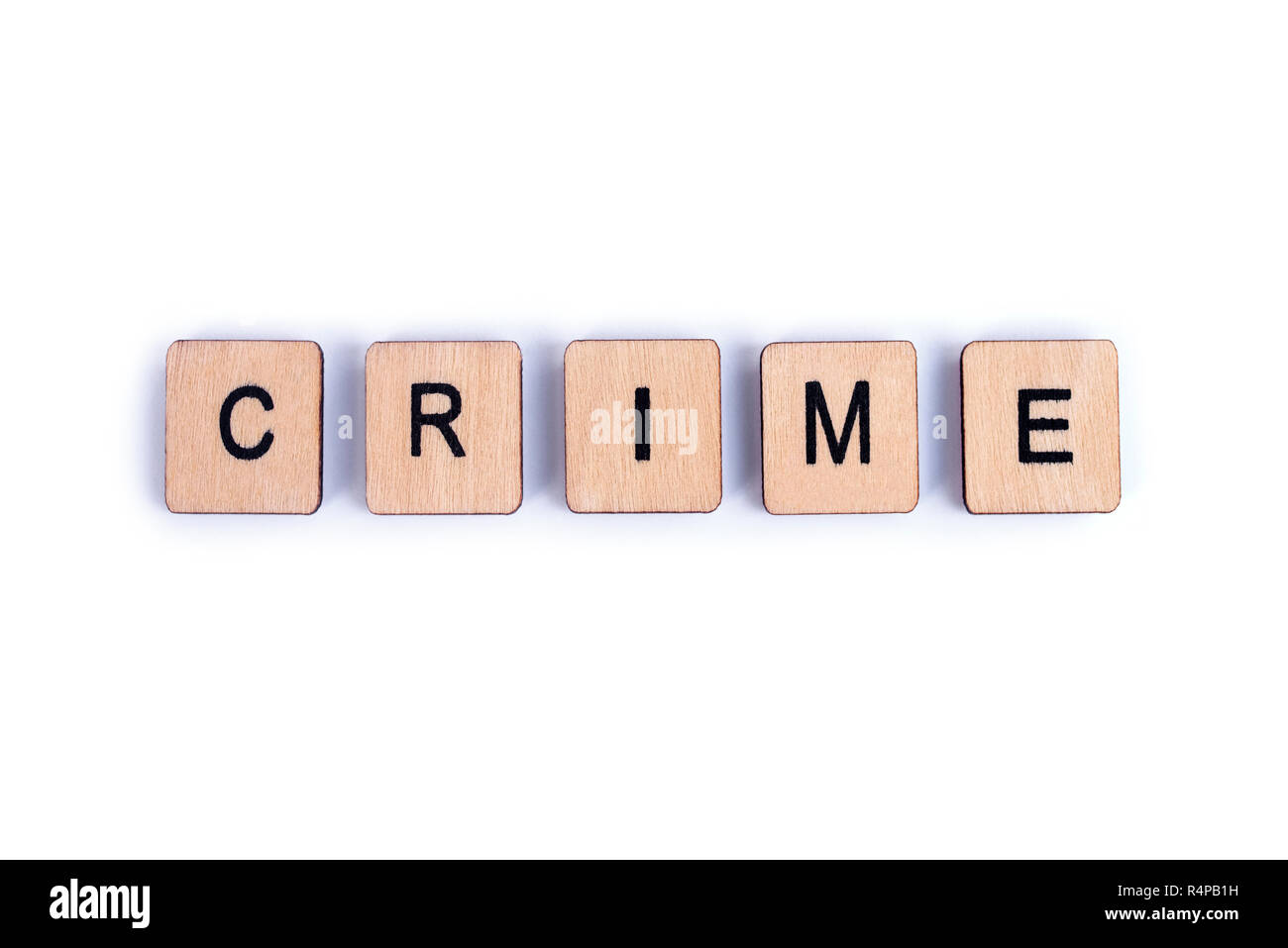 The word CRIME, spelt with wooden letter tiles Stock Photo - Alamy