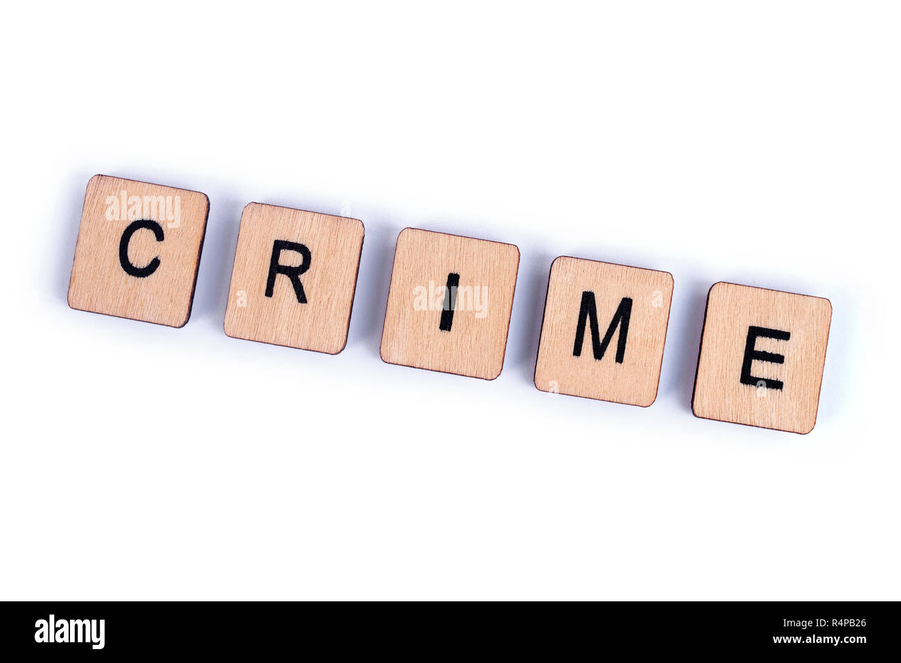 The word CRIME, spelt with wooden letter tiles Stock Photo - Alamy