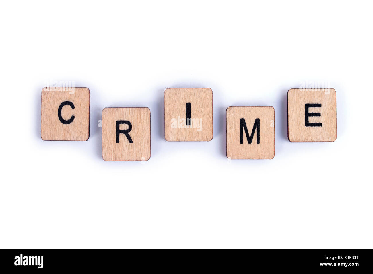 The word CRIME, spelt with wooden letter tiles Stock Photo - Alamy