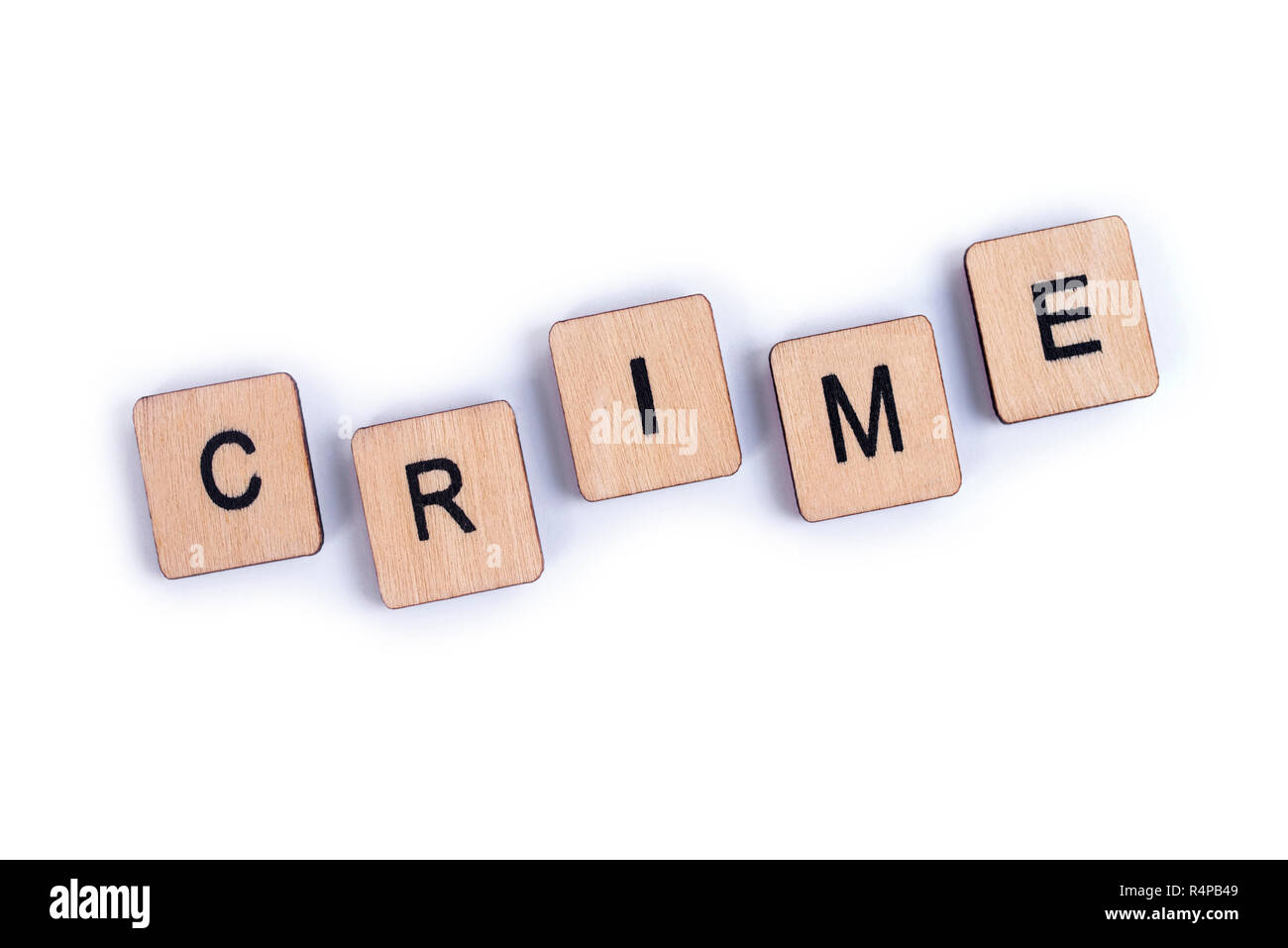 The word CRIME, spelt with wooden letter tiles Stock Photo - Alamy