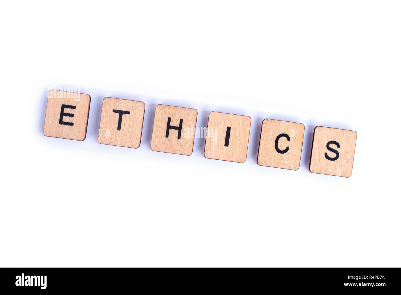 The word ETHICS, spelt with wooden letter tiles Stock Photo - Alamy