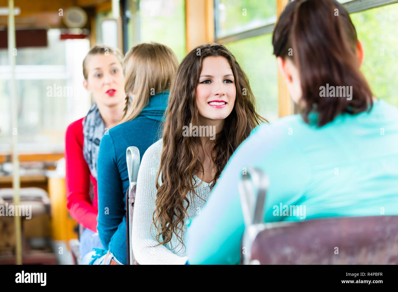 Group of people commuting in tram or cable car Stock Photo - Alamy