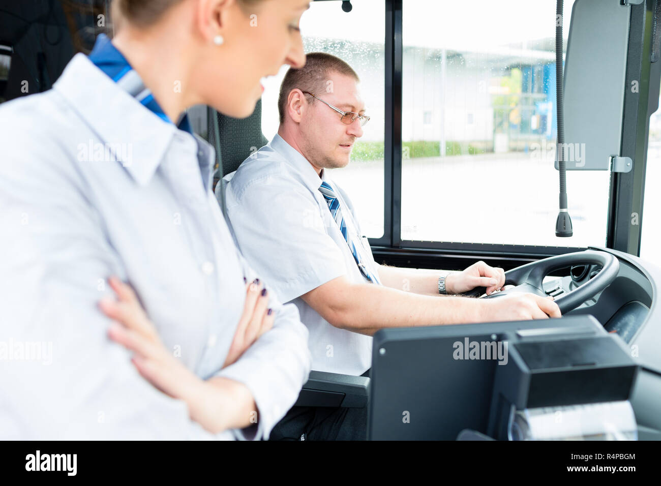 Bus or coach driver and tourist guide Stock Photo - Alamy
