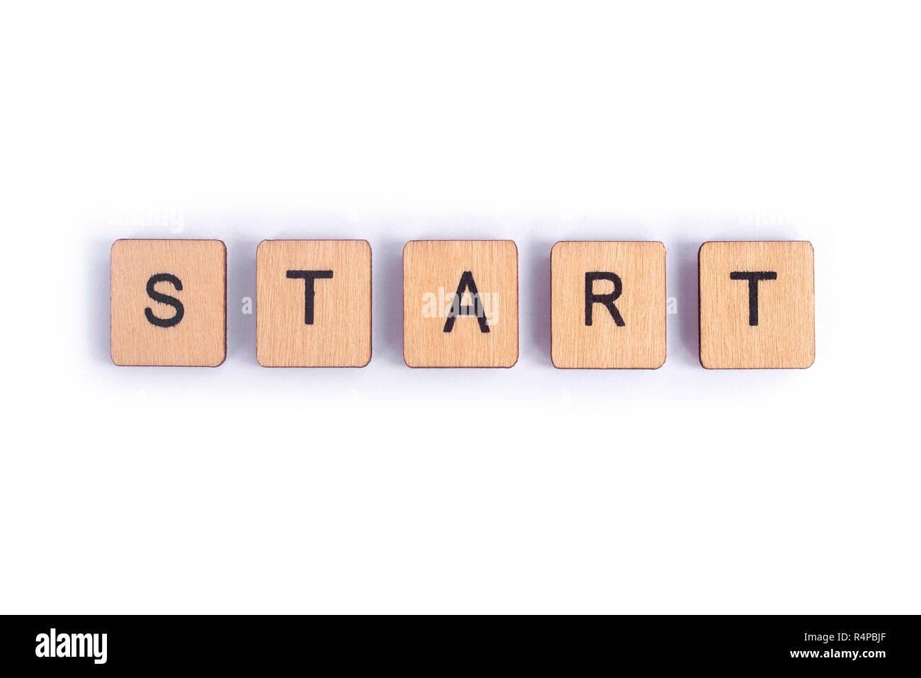 The word START, spelt with wooden letter tiles Stock Photo - Alamy