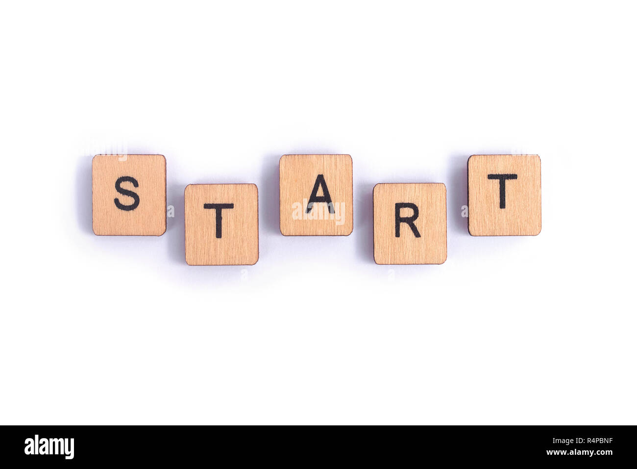 The word START, spelt with wooden letter tiles Stock Photo - Alamy