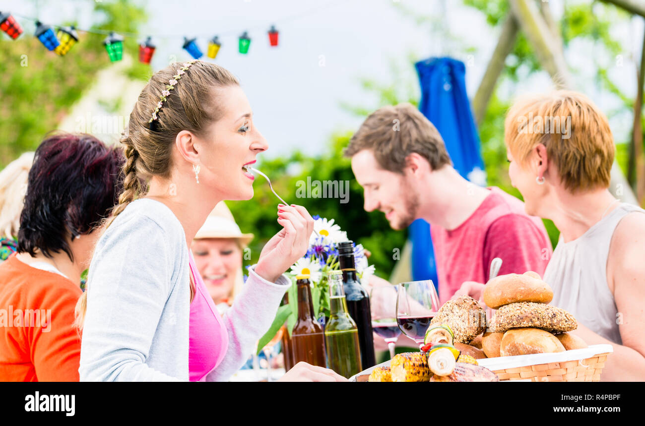 Woman eating sausage bbq hi-res stock photography and images - Alamy