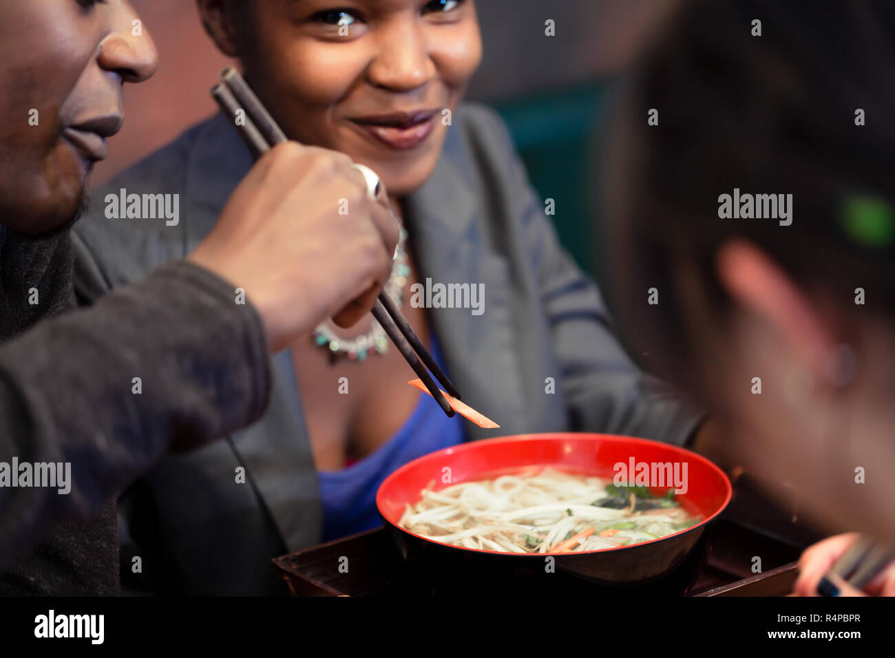 Friends eating noodle soup in Japanese Restaurant Stock Photo - Alamy