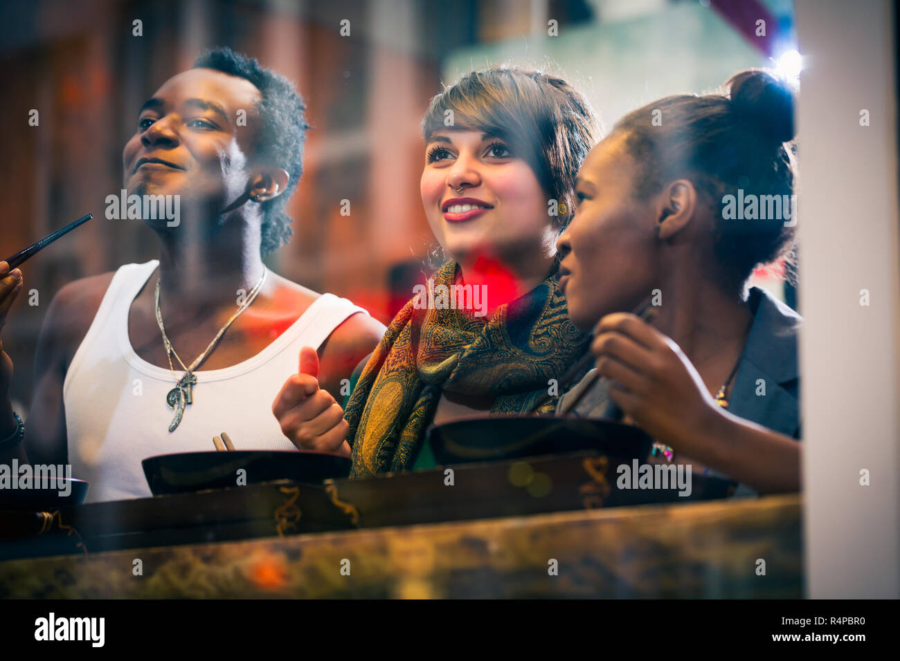 Man and women eating late in Korean eatery Stock Photo - Alamy