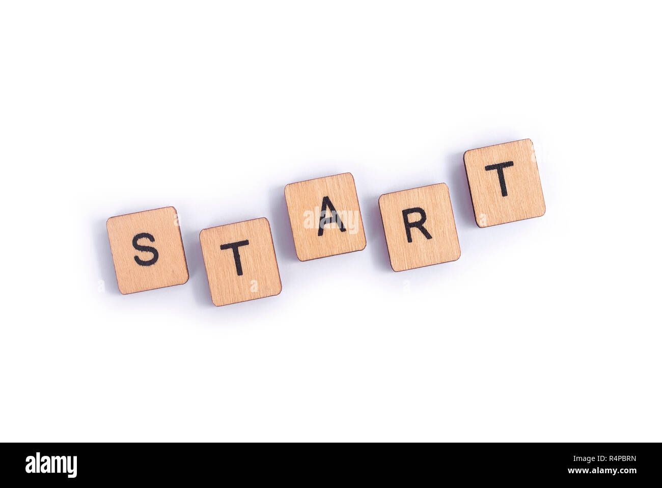 The word START, spelt with wooden letter tiles Stock Photo - Alamy