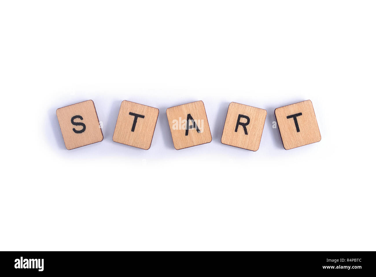 The word START, spelt with wooden letter tiles Stock Photo - Alamy