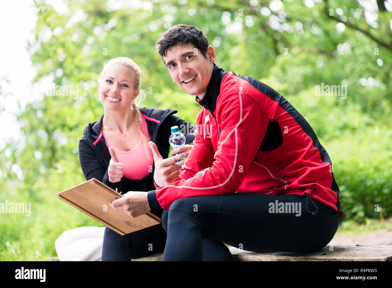 Woman with personal trainer at running evaluation Stock Photo - Alamy