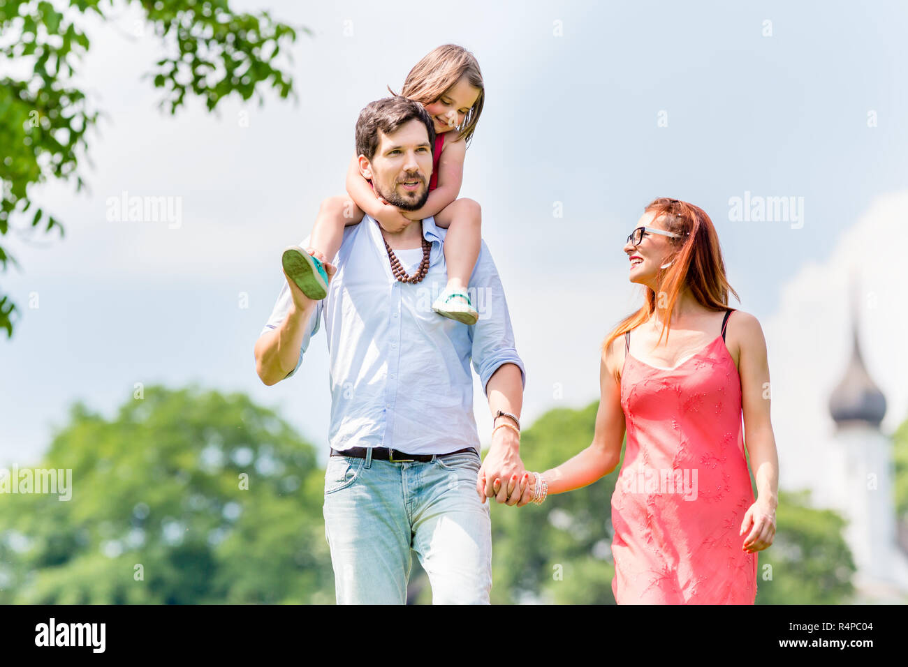 Family walk - Father carrying kid on his shoulder Stock Photo - Alamy