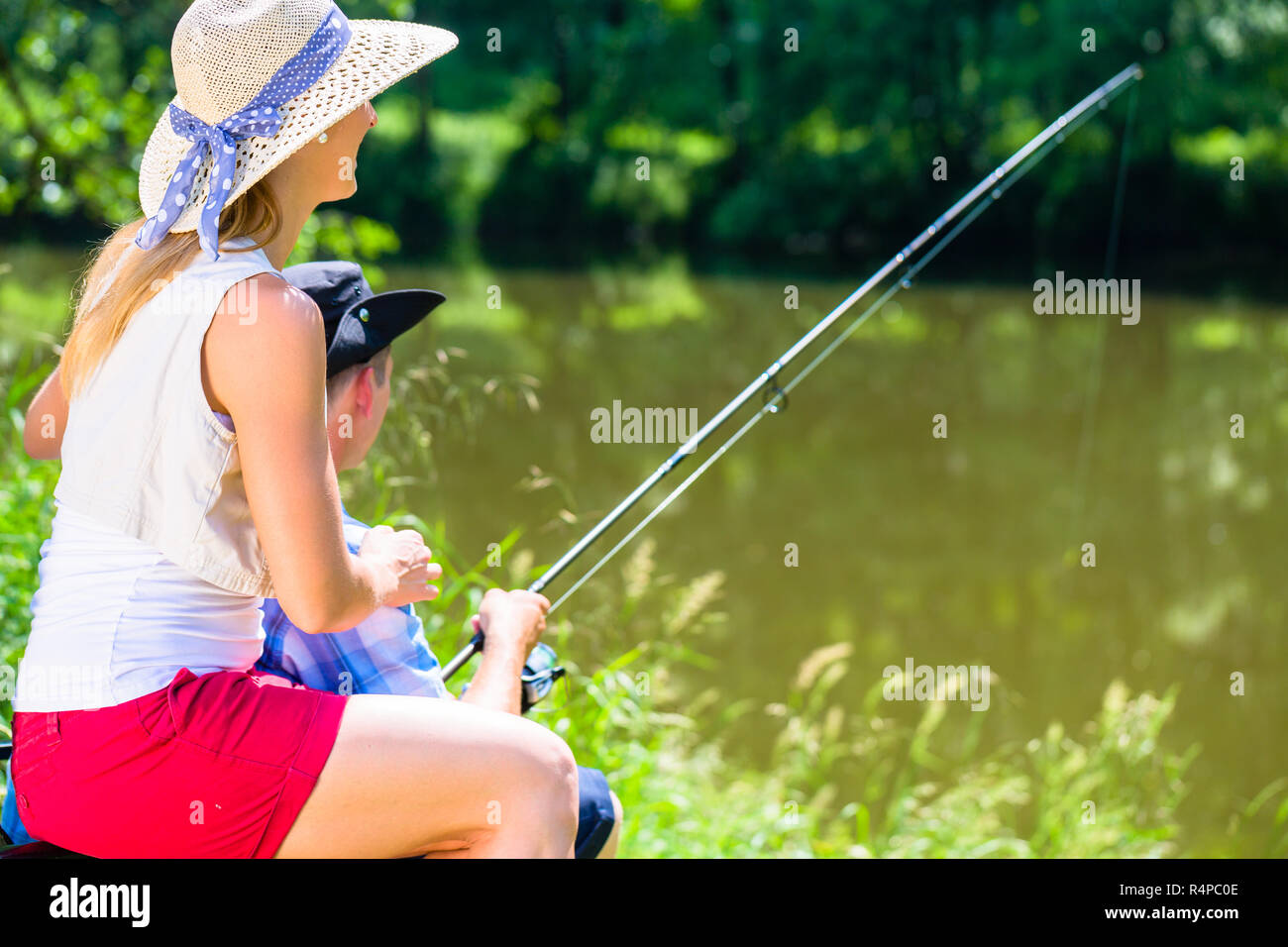 Fisherman sitting bank river lake hi-res stock photography and images ...