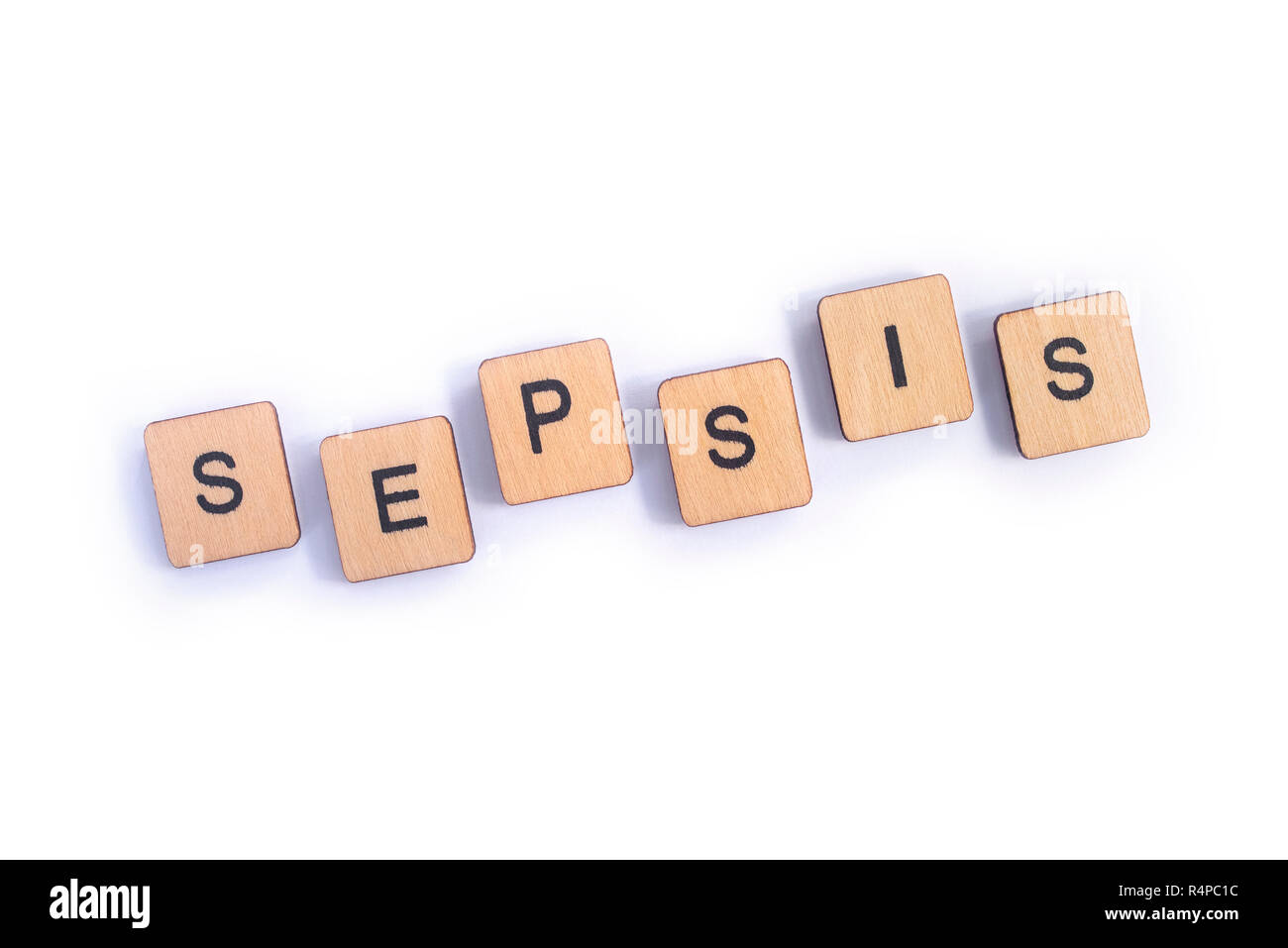The word SEPSIS spelt with wooden letter tiles Stock Photo - Alamy
