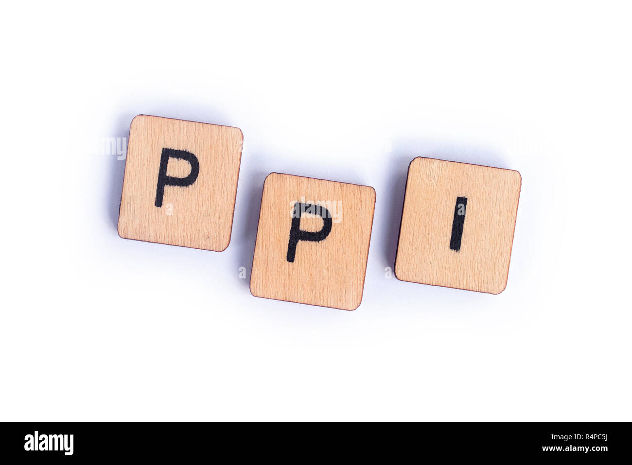 The abbreviation PPI - Payment Protection Insurance - spelt with wooden ...