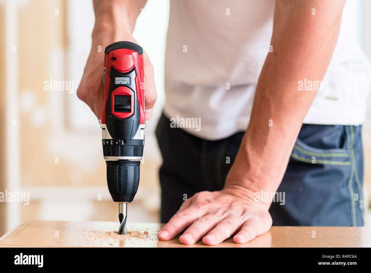 Craftsman or DIY man working with power drill Stock Photo - Alamy