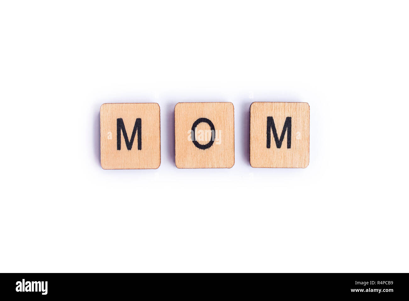 The word MOM, spelt with wooden letter tiles Stock Photo - Alamy