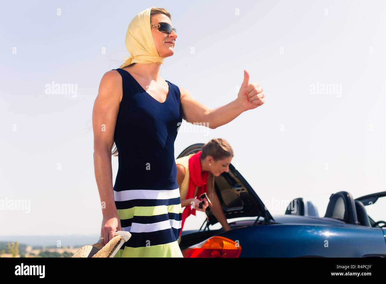 Two women having engine breakdown on summer joyride Stock Photo - Alamy