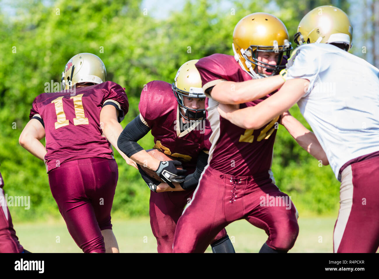 Football players run after ball hi-res stock photography and images - Alamy