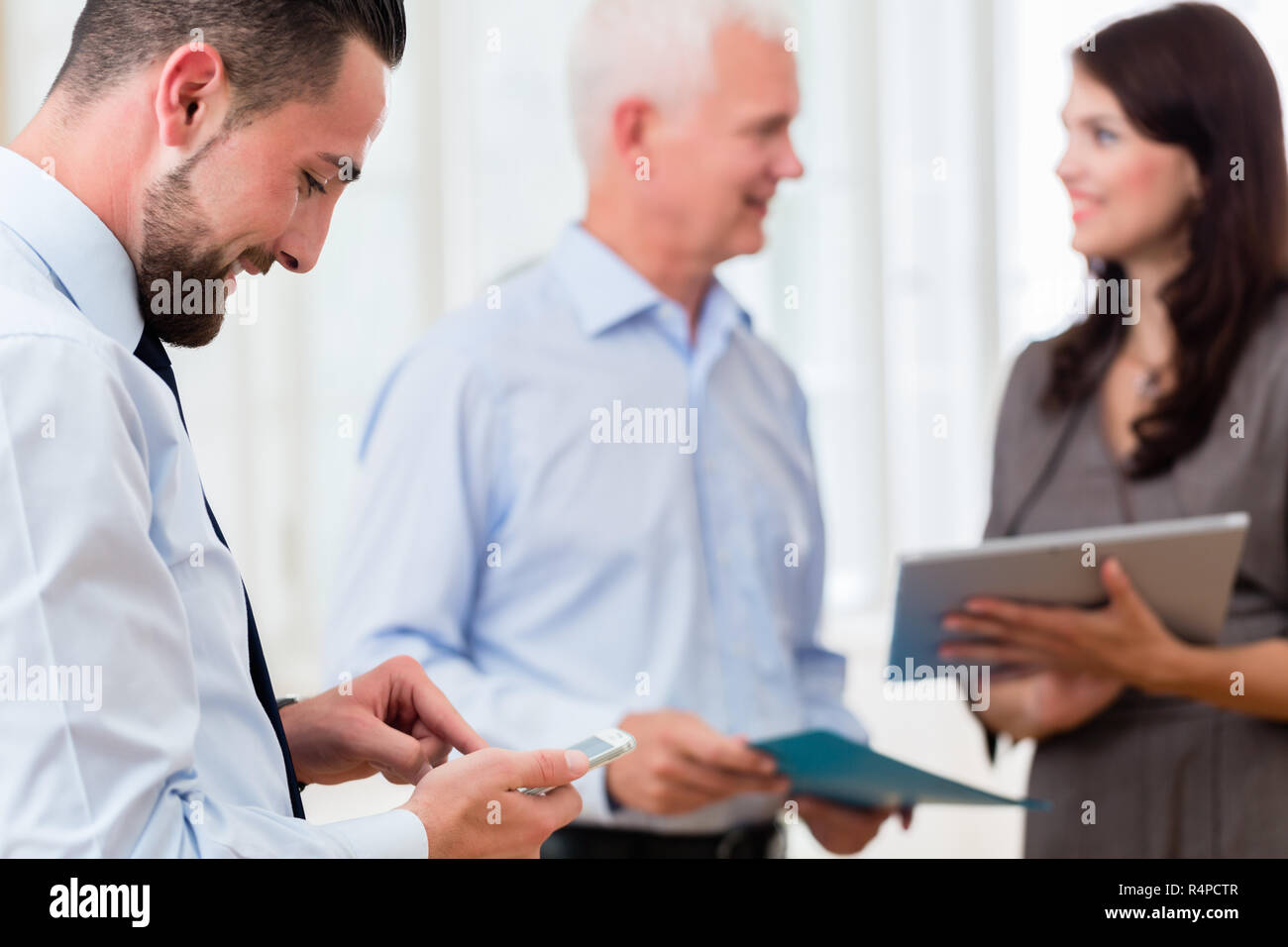 Business people in office at short presentation Stock Photo - Alamy