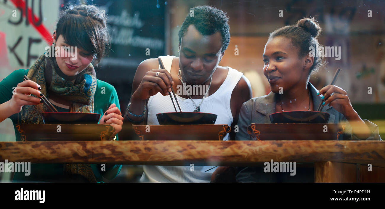 Man and women eating late in Korean eatery Stock Photo - Alamy